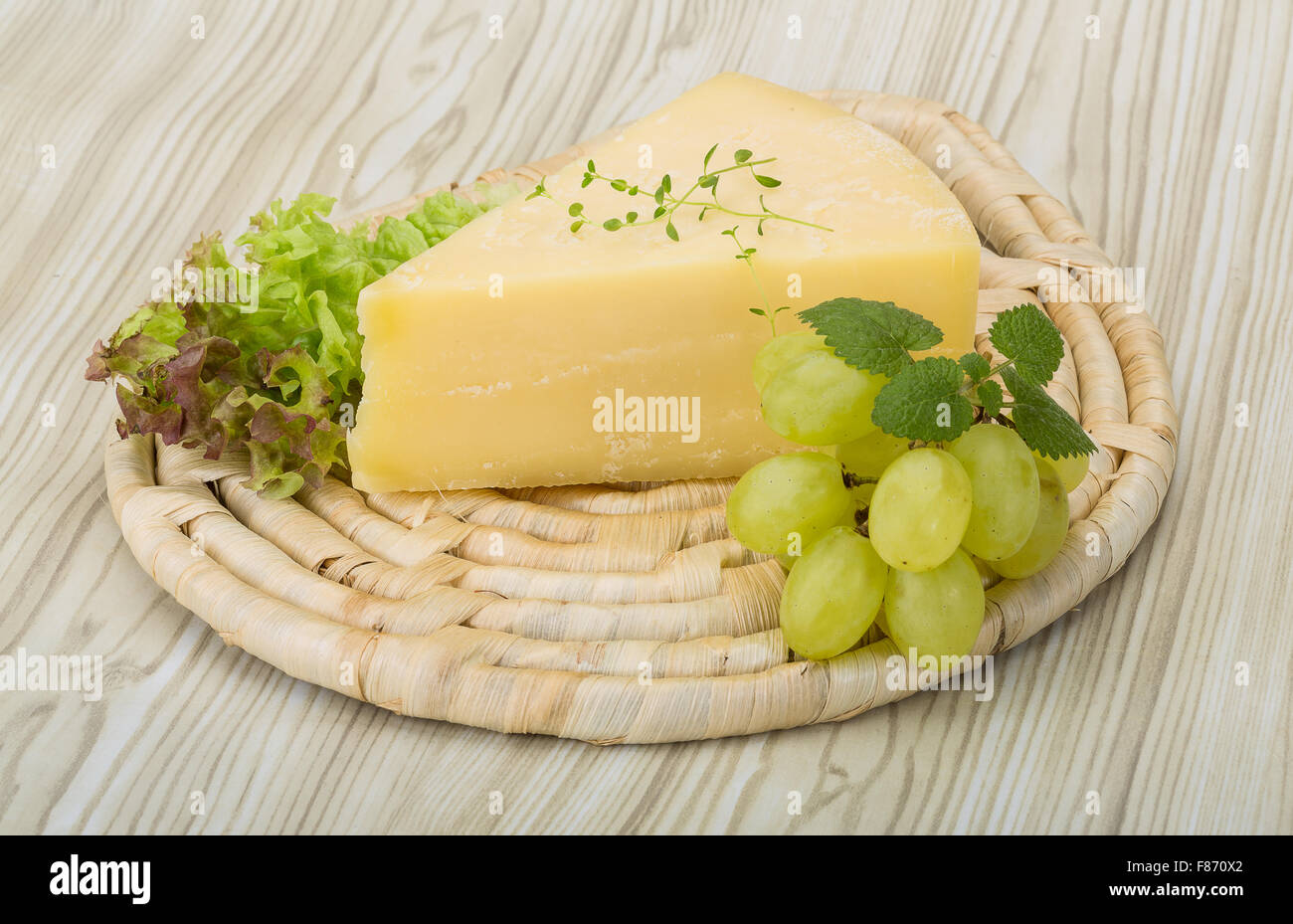 Part of parmesan cheese on the wood backgrounds Stock Photo - Alamy