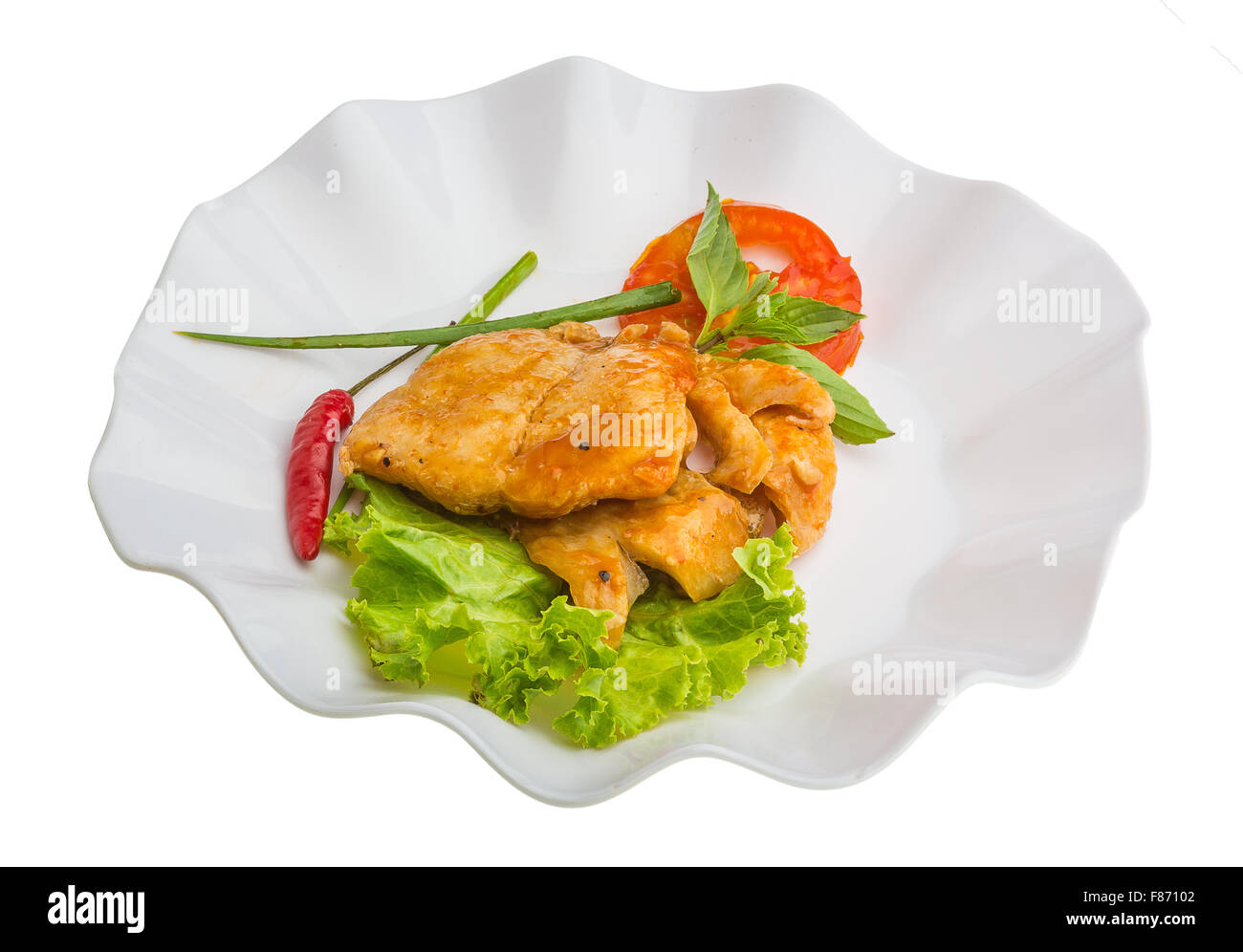 Baracuda steak with sauce and salad Stock Photo - Alamy