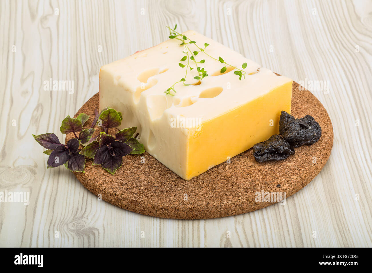 Yellow Cheese maasdam - with thyme and basil Stock Photo - Alamy