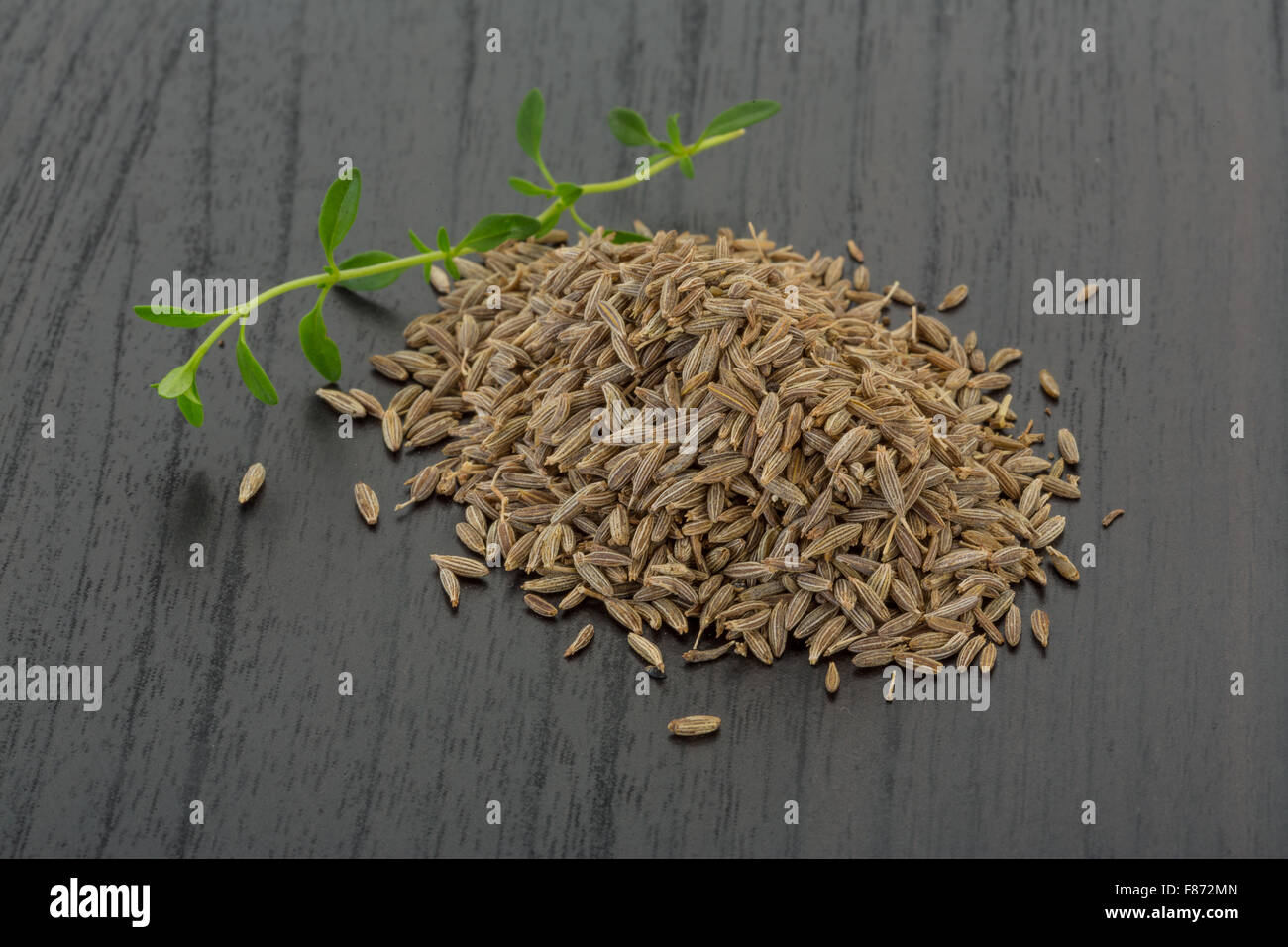 Zira seeds heap on the desk Stock Photo - Alamy