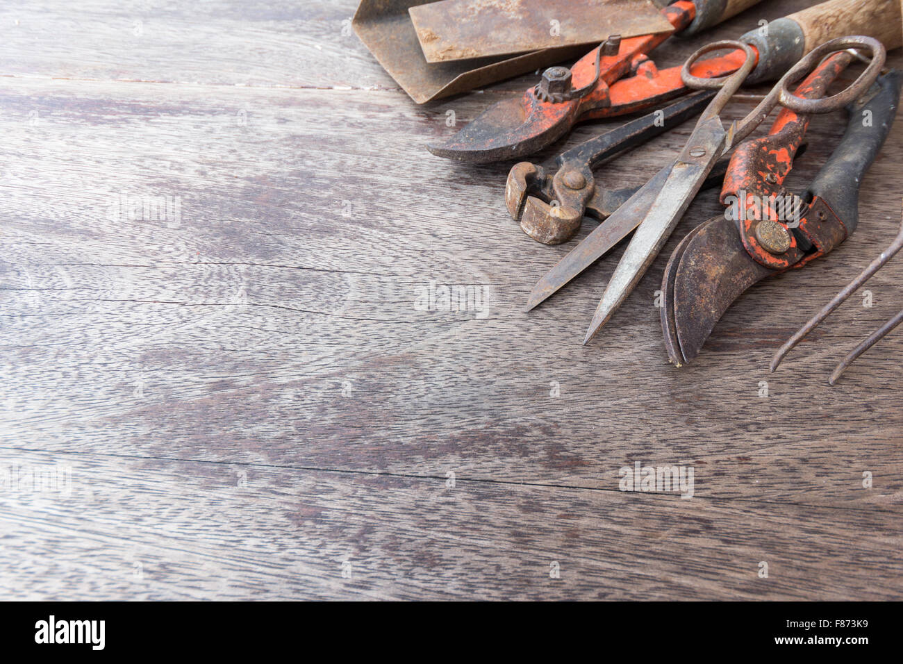 Old rusty tools - vintage handicraft tools on wooden background with ...