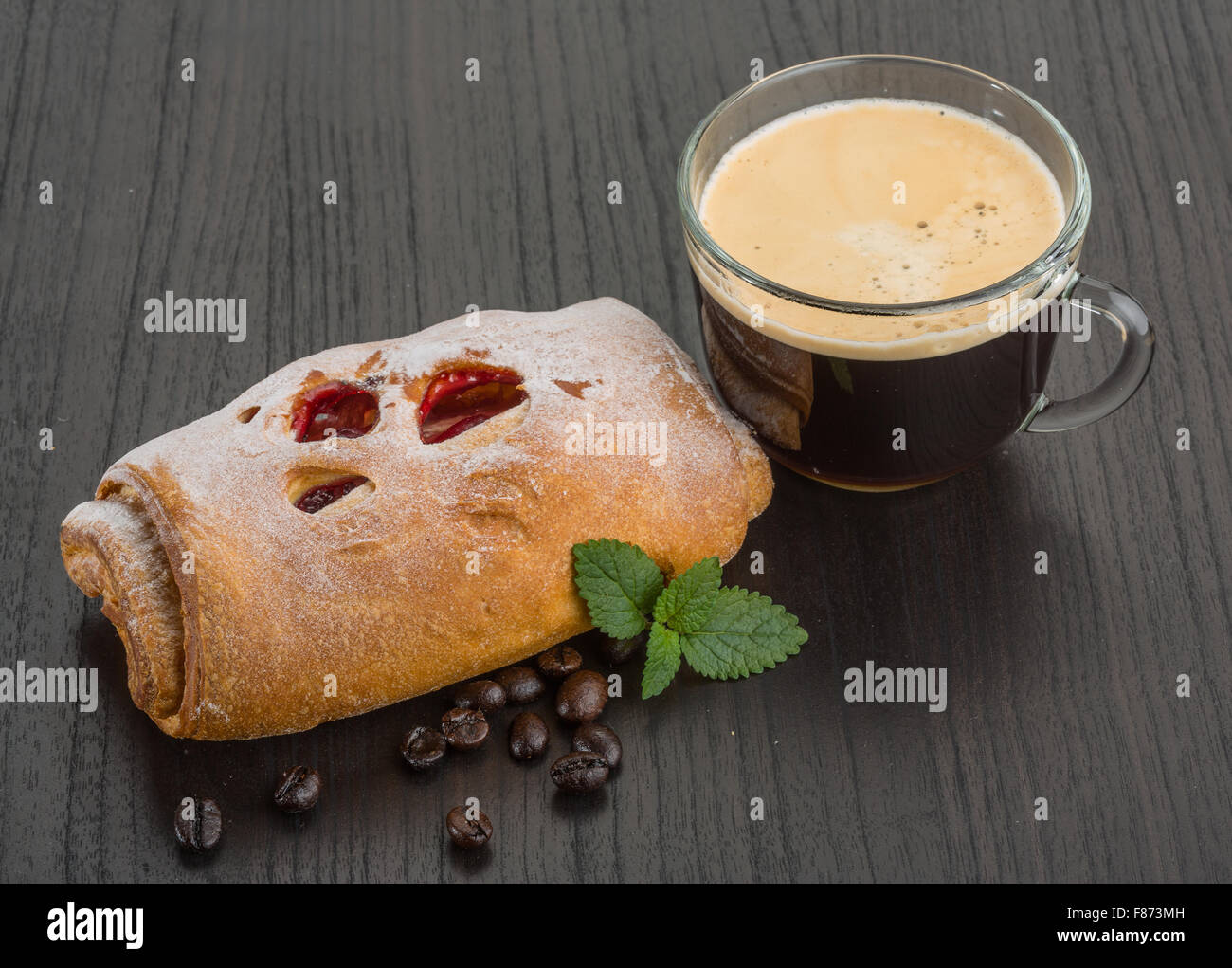 Coffee with bun and mint Stock Photo - Alamy