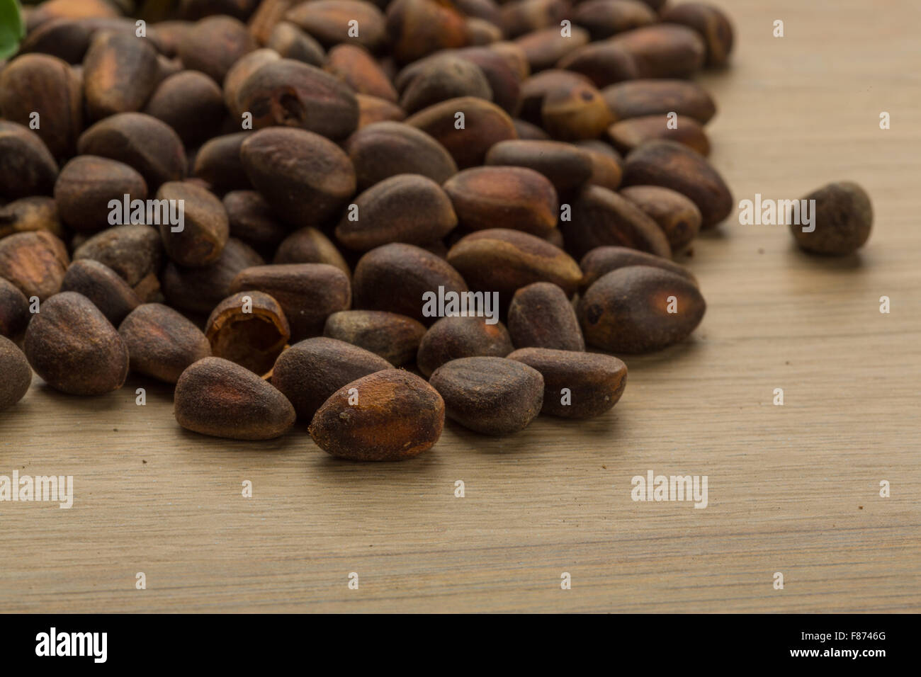 Cedar nuts on the desk Stock Photo - Alamy