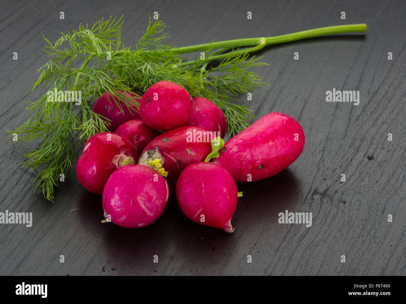 Radish with dill on the desk Stock Photo - Alamy
