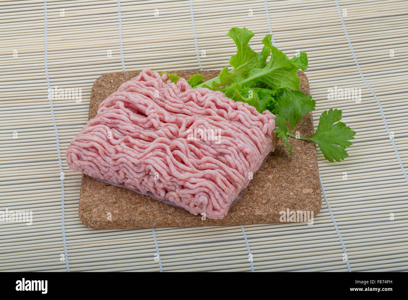 Raw minced pork meat on the desk with herbs Stock Photo - Alamy