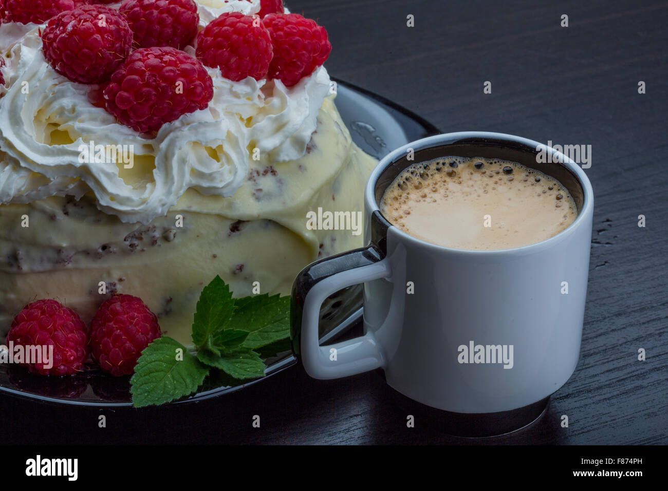 Coffee with raspberry cake and mint Stock Photo - Alamy