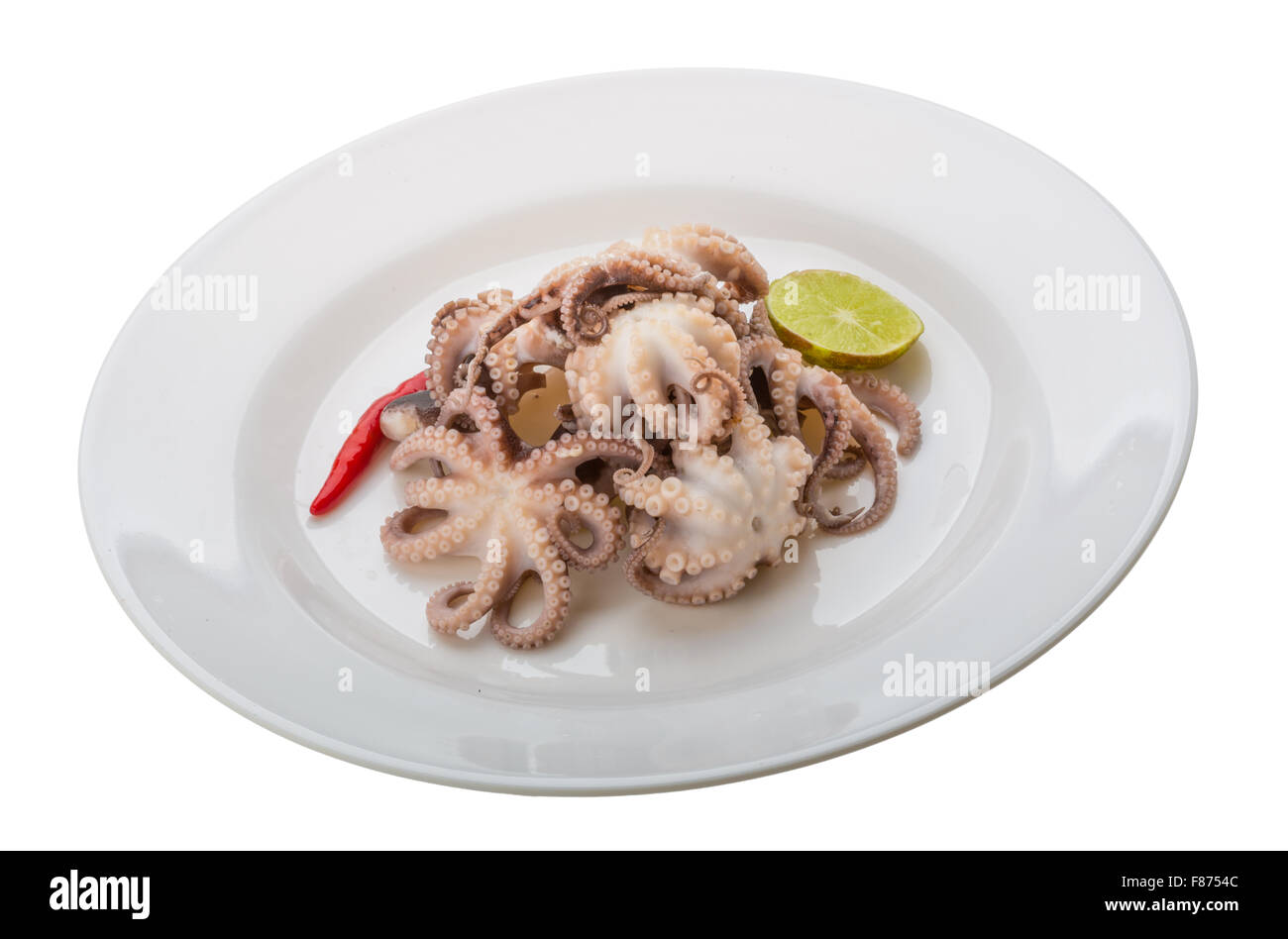 Boiled octopus with pepper and lime Stock Photo - Alamy