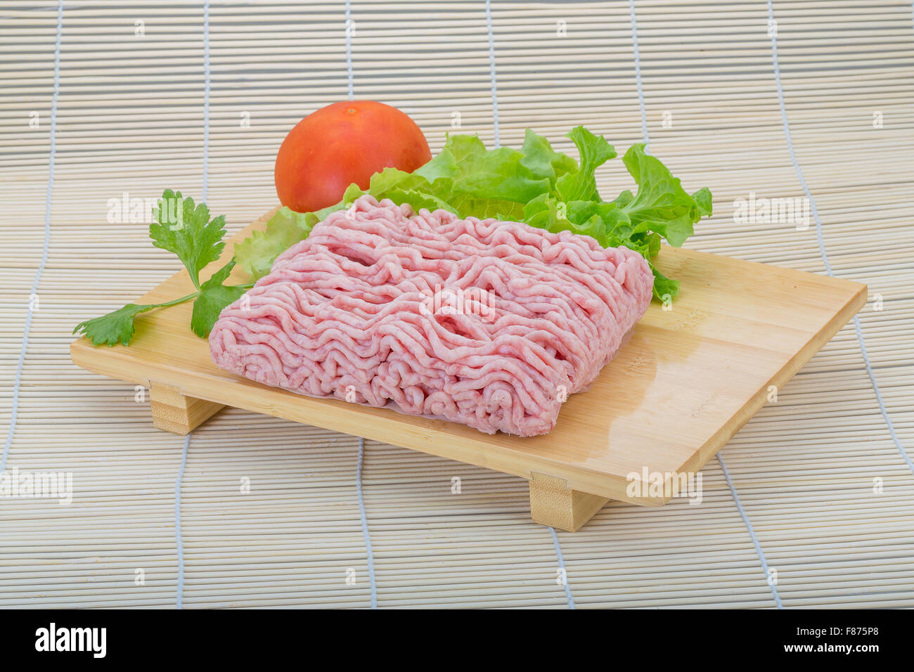 Raw minced pork meat on the desk with herbs Stock Photo - Alamy
