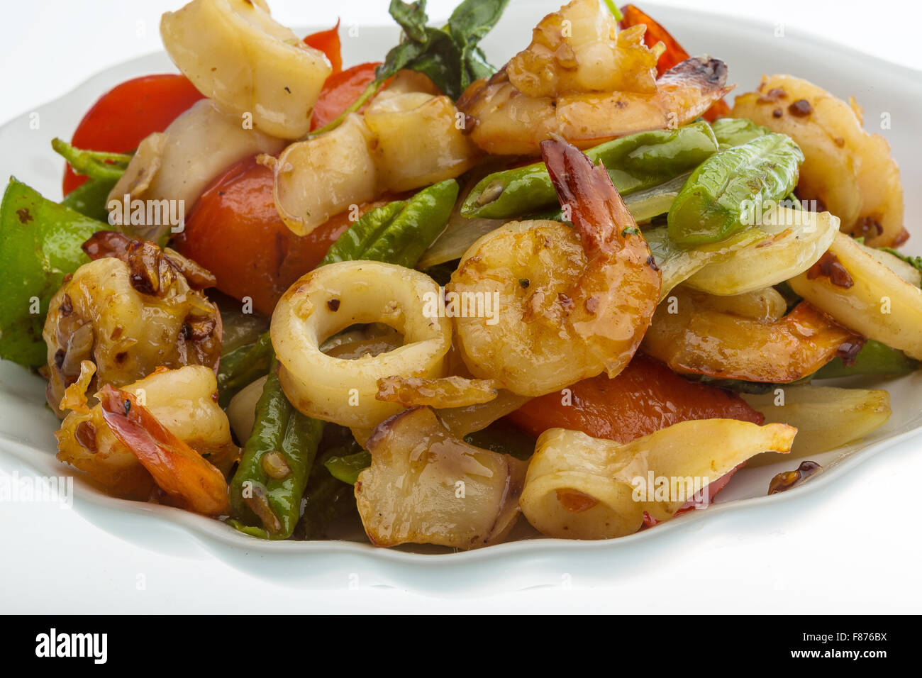 Seafood with vegetables - shrimps and calamari Stock Photo - Alamy