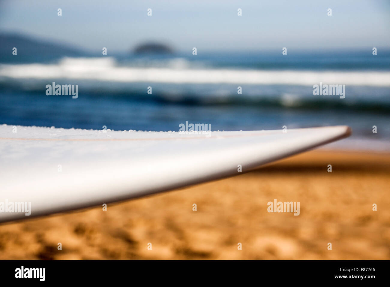 tip a surfboard on the beach Stock Photo - Alamy