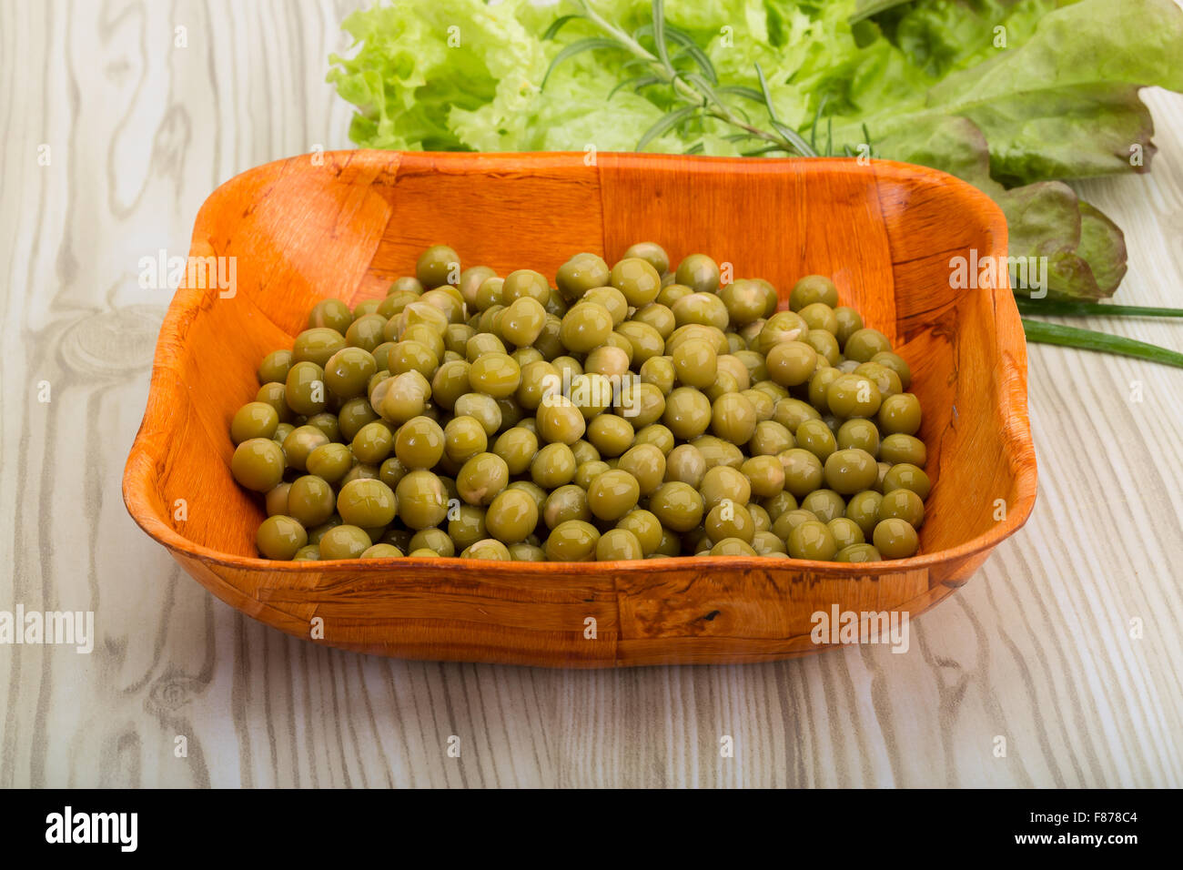 Marinated peas - in the bowl with salad leaves Stock Photo - Alamy