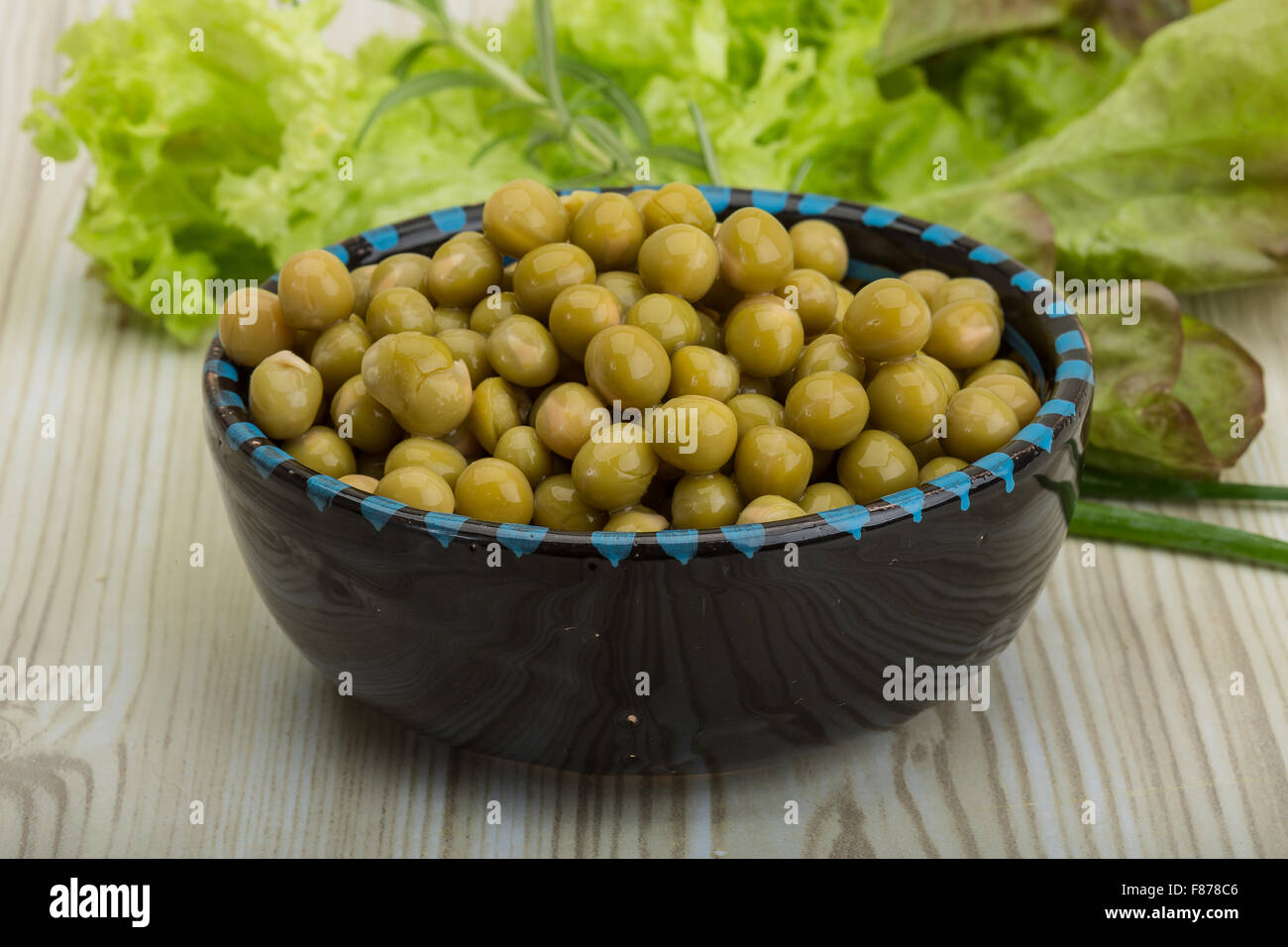 Marinated peas - in the bowl with salad leaves Stock Photo - Alamy