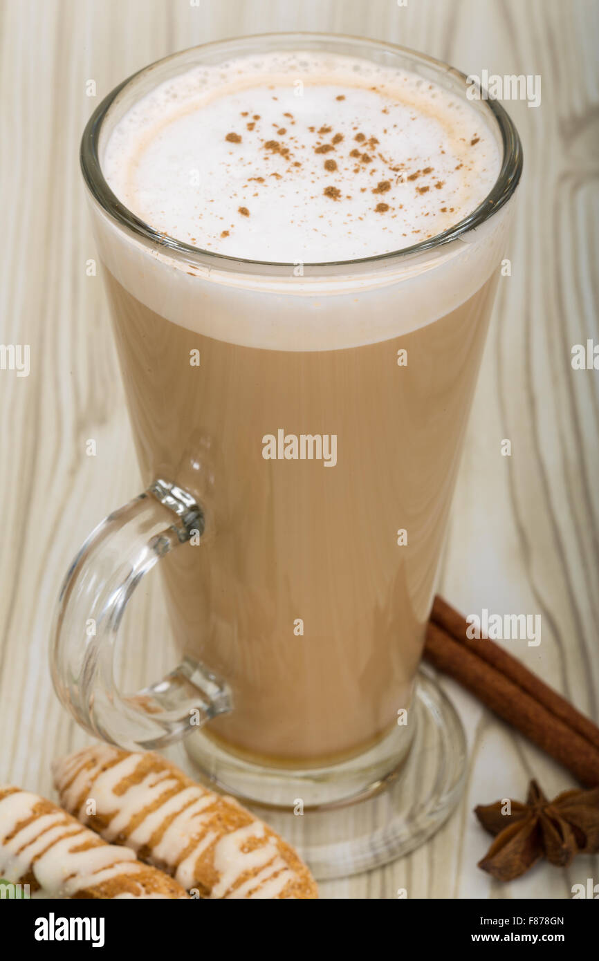 Cappuccino with pastry, cinnamon and flower Stock Photo - Alamy