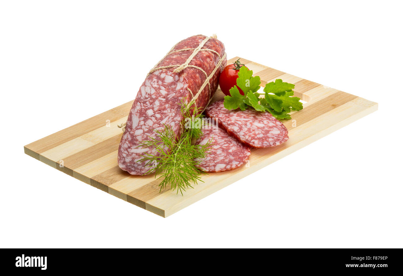 Salami sausages sliced with basil Stock Photo - Alamy