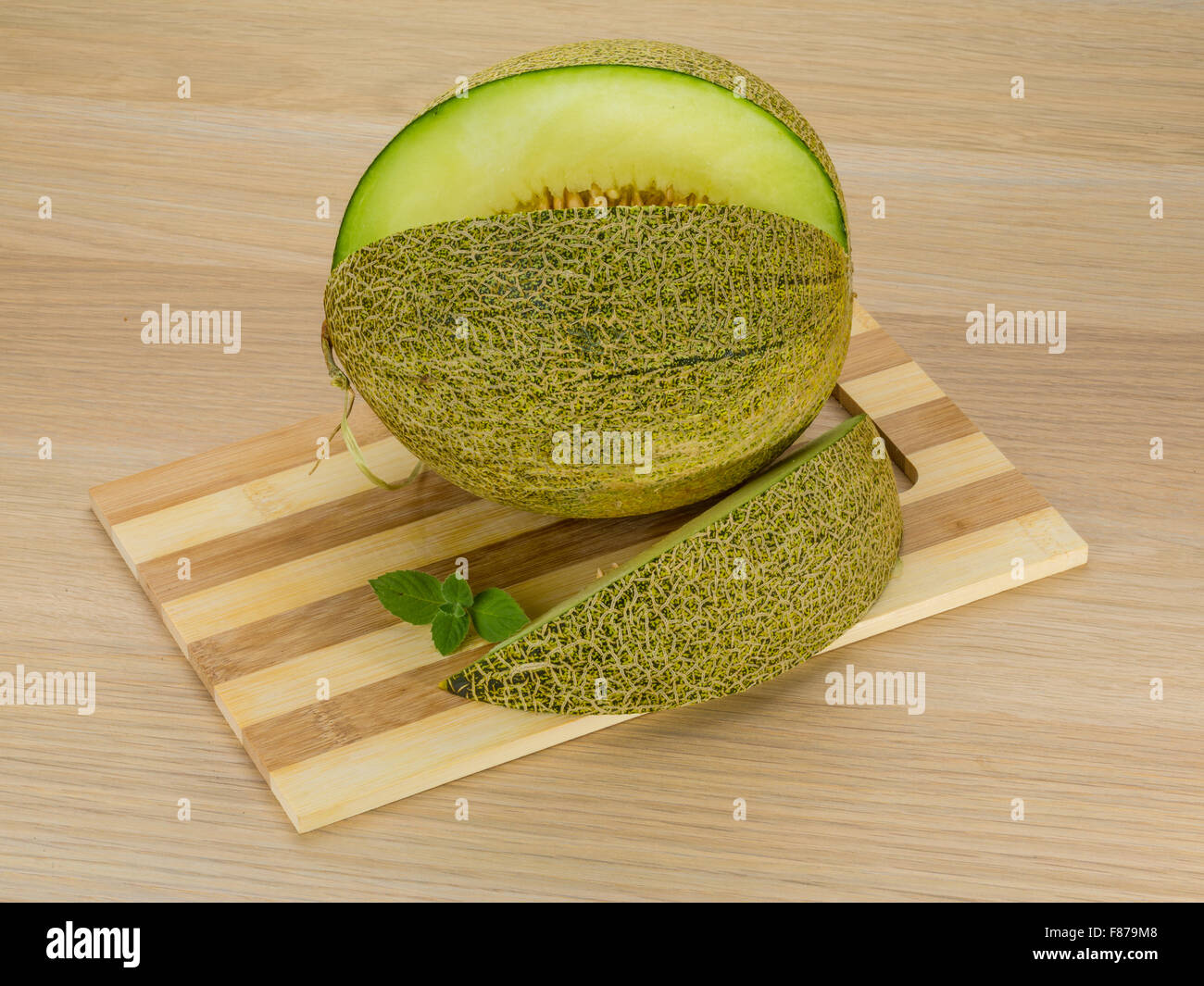 Fresh ripe melon sliced on the desk Stock Photo - Alamy