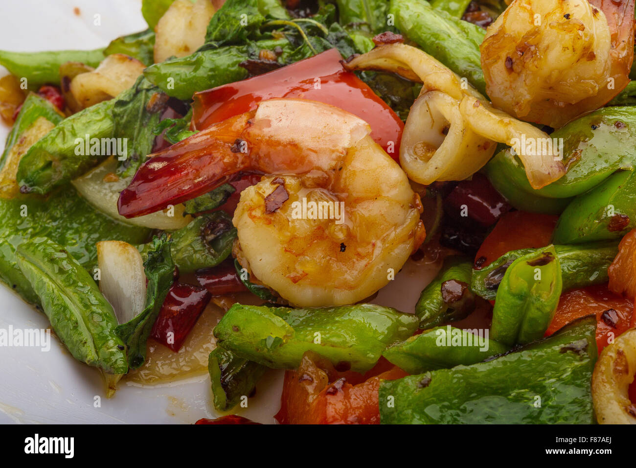 Seafood with vegetables - shrimps and calamari Stock Photo - Alamy