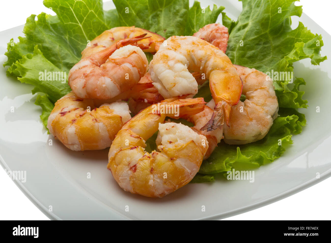 Unshelled king prawn heap with salad leaves Stock Photo - Alamy