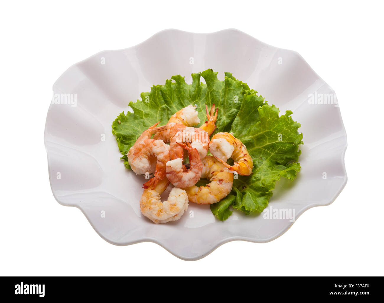Unshelled king prawn heap with salad leaves Stock Photo - Alamy