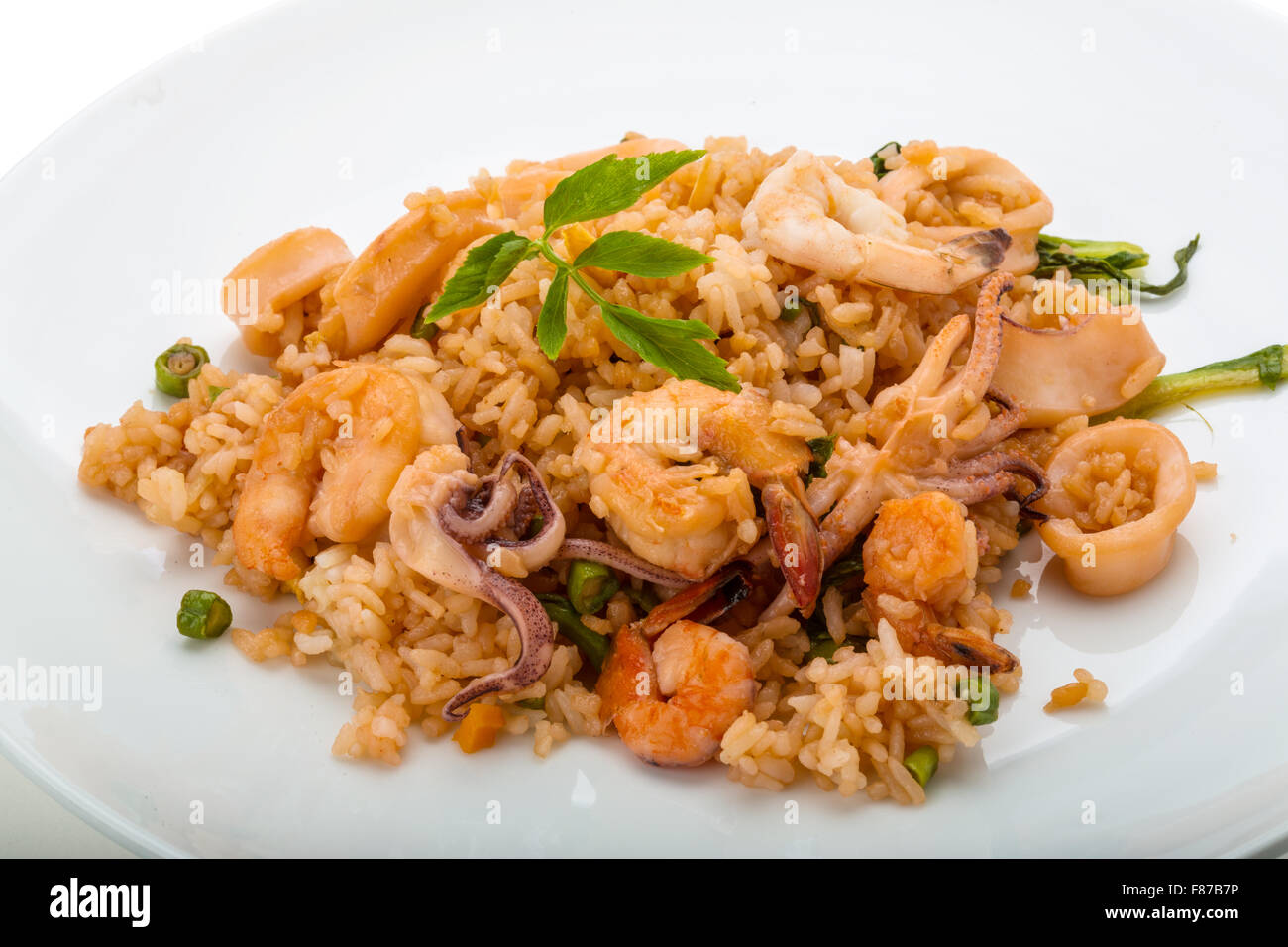 Rice with seafood isolated on white Stock Photo - Alamy