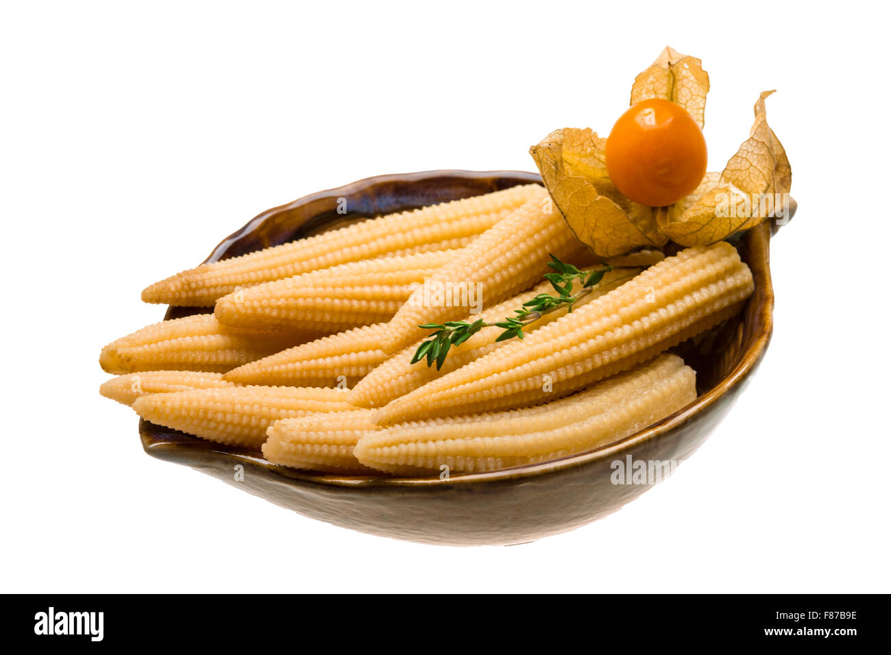 Baby corn with thyme Stock Photo - Alamy