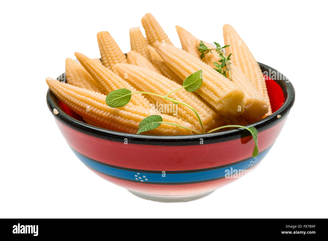 Baby corn with thyme Stock Photo - Alamy