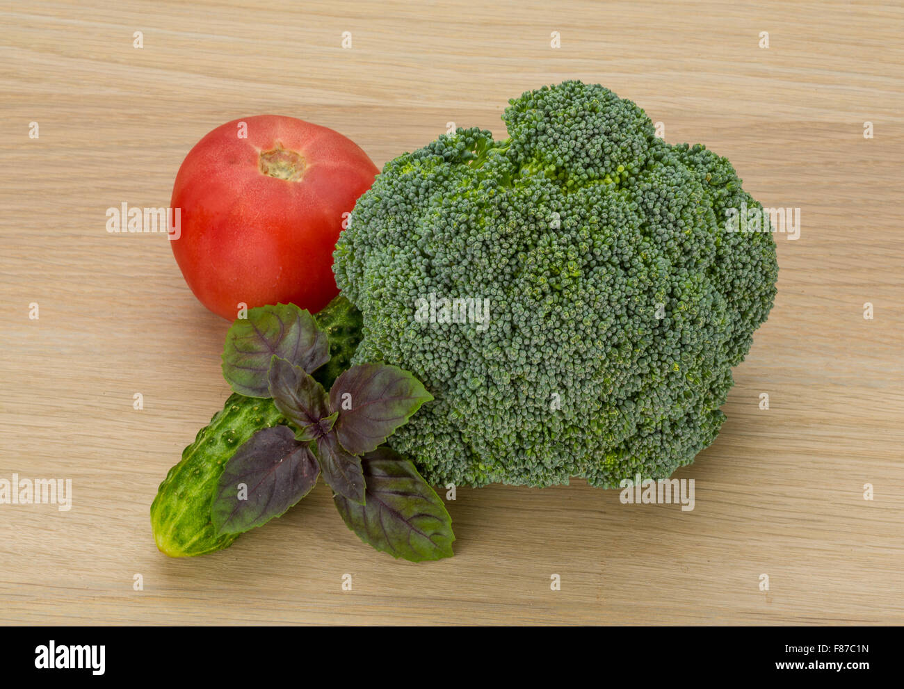 Fresh ripe broccoli with tomato and cucumber Stock Photo - Alamy