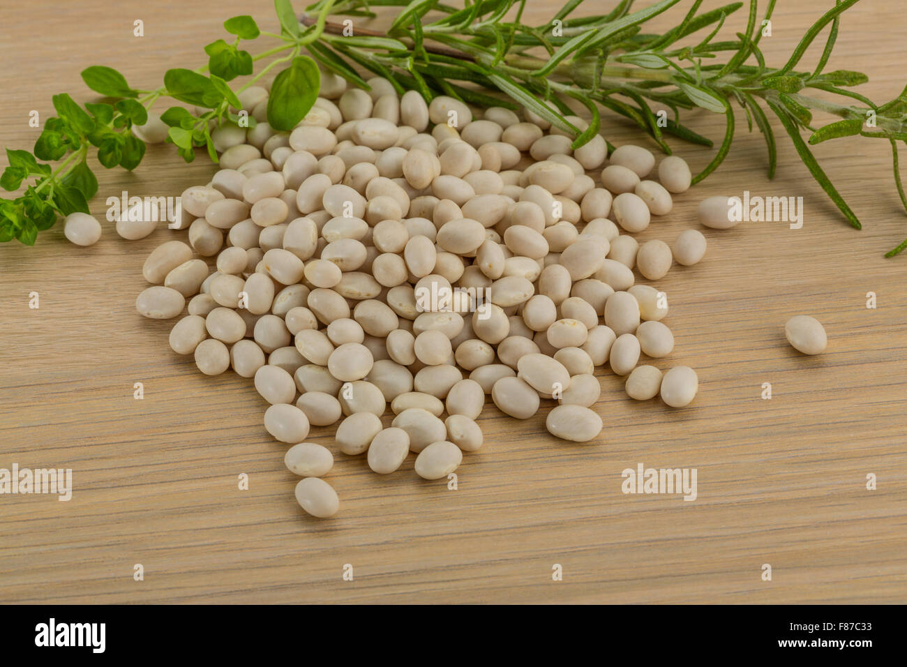 Raw white beans on the board Stock Photo - Alamy
