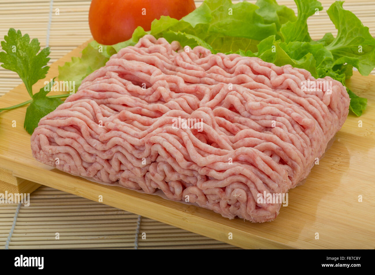 Raw minced pork meat on the desk with herbs Stock Photo - Alamy
