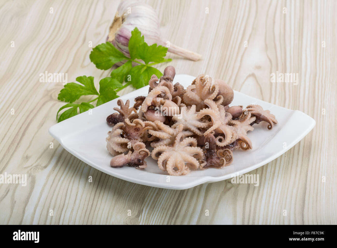 Boiled octopus - mini seafood in the bowl Stock Photo - Alamy