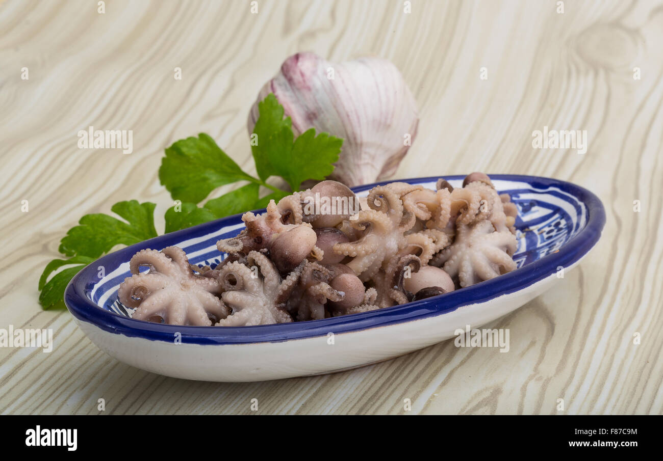 Boiled octopus - mini seafood in the bowl Stock Photo - Alamy