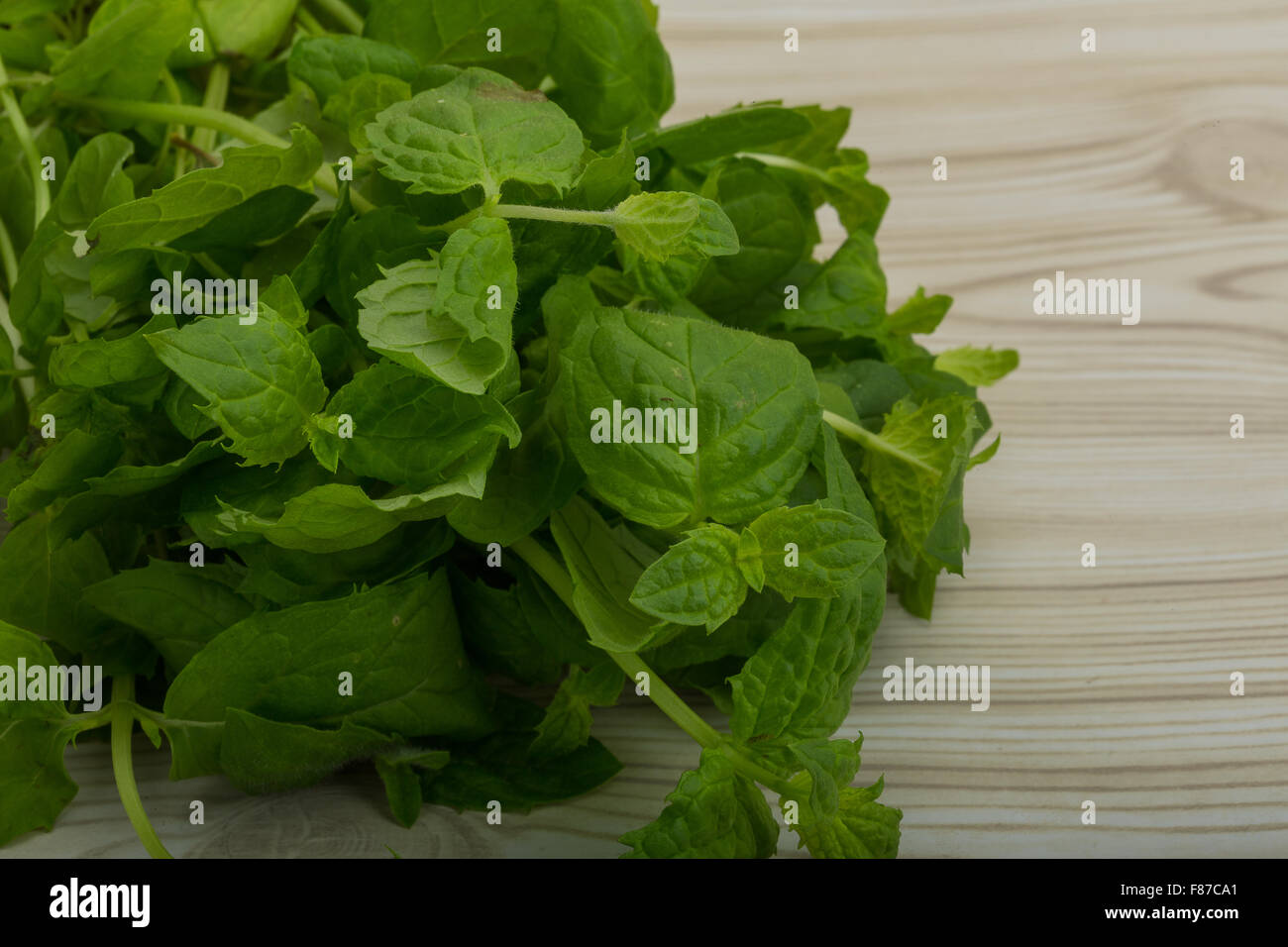 fresh Mint leaves - on the board Stock Photo - Alamy