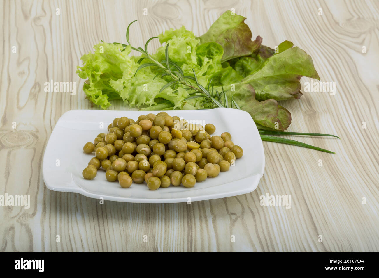 Marinated peas - in the bowl with salad leaves Stock Photo - Alamy
