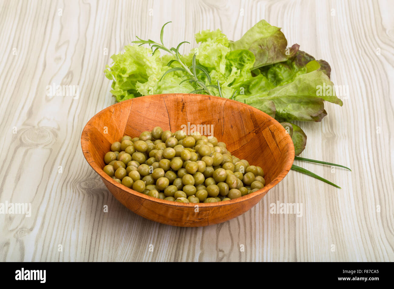 Marinated peas - in the bowl with salad leaves Stock Photo - Alamy