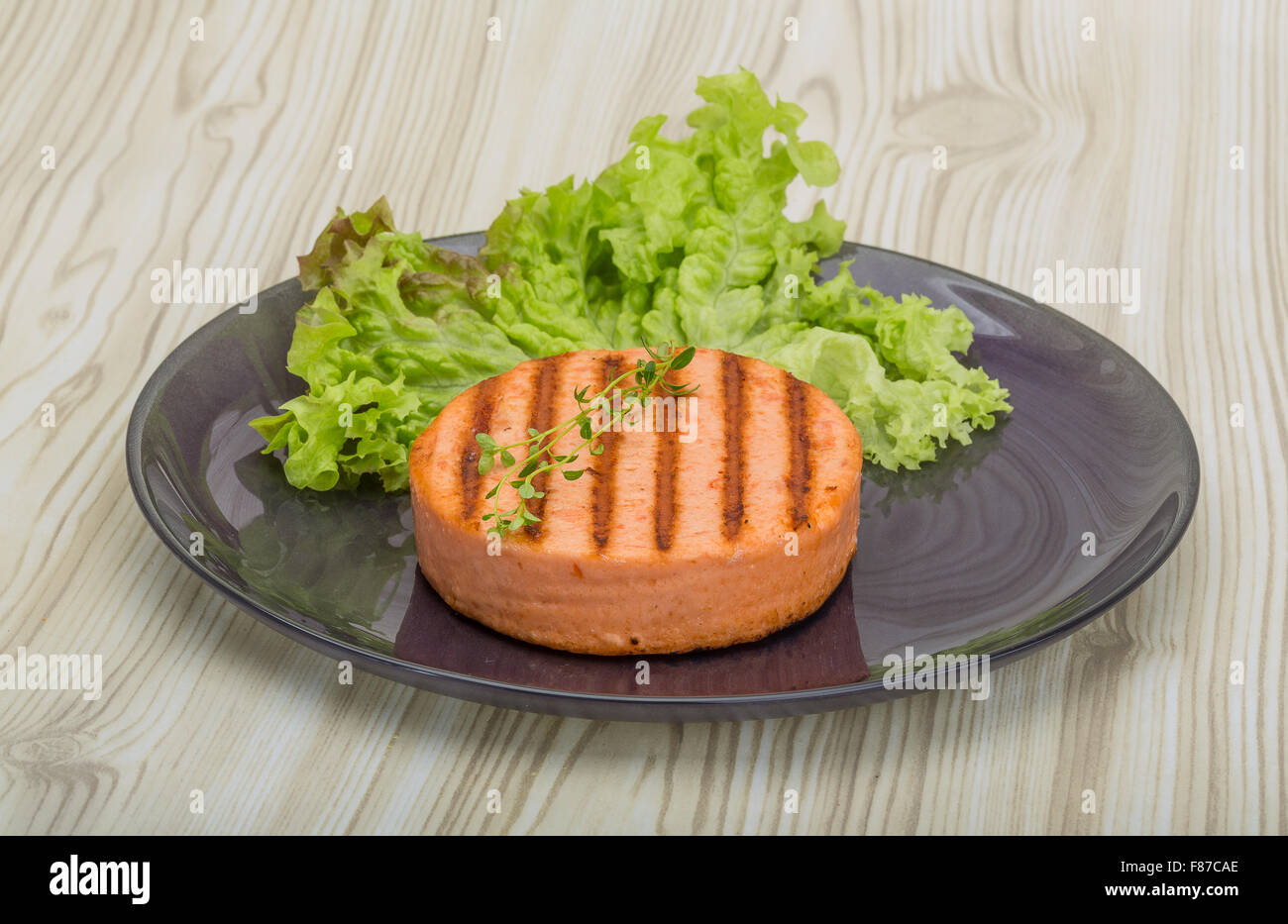 Grilled Fish cakes in the bowl with salad leaves Stock Photo - Alamy