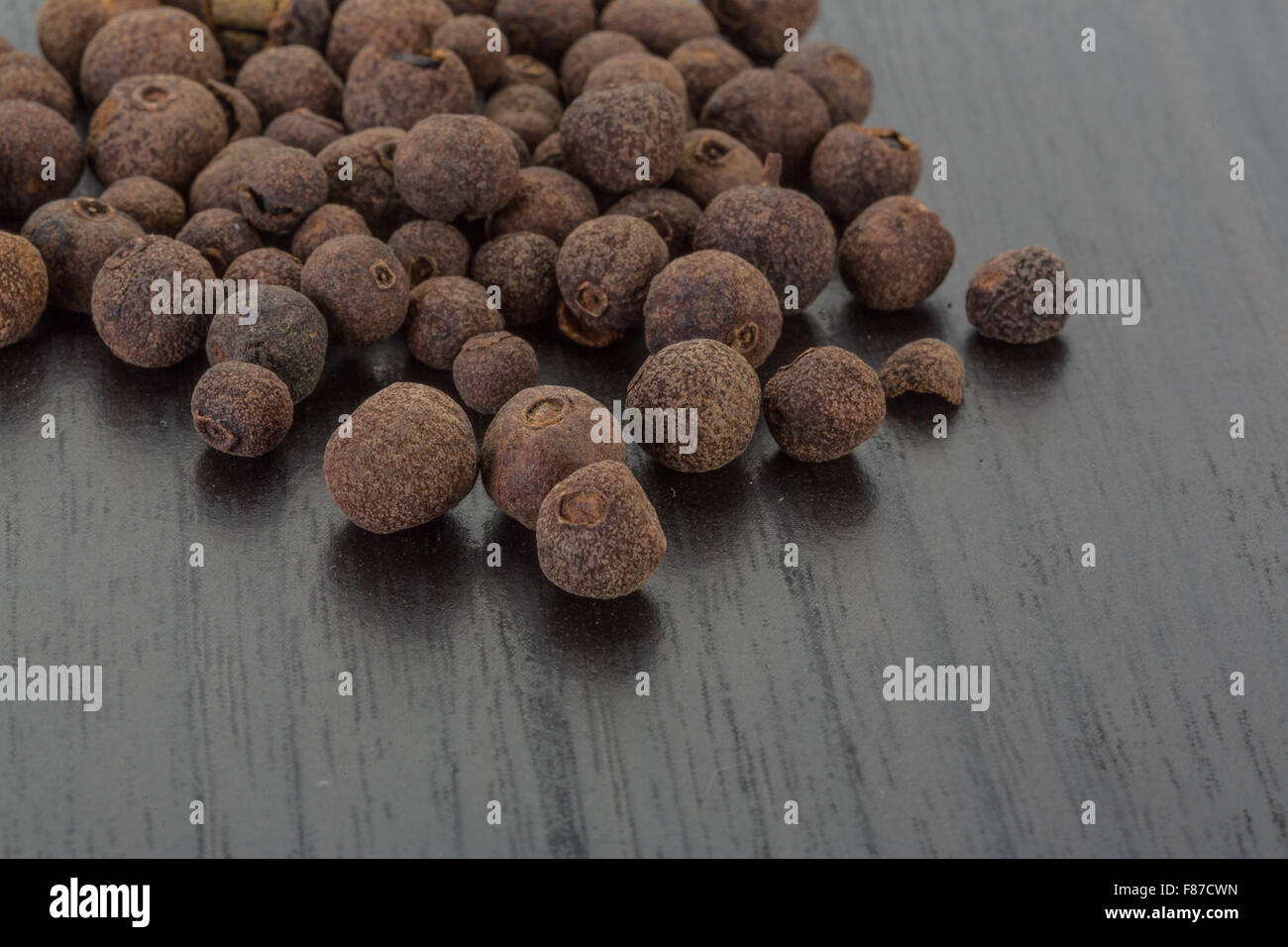 Black Pepper corn heap on the desk Stock Photo - Alamy