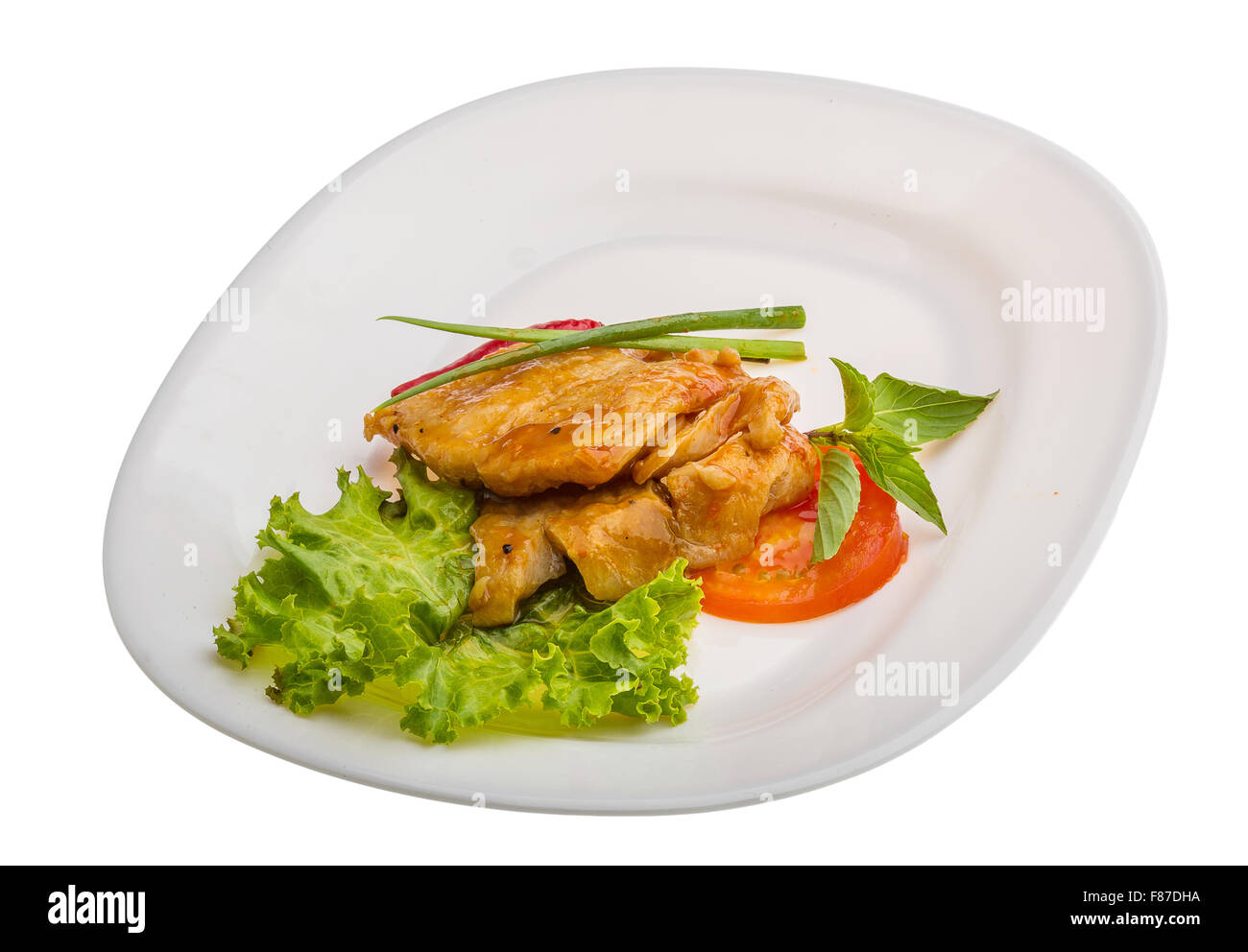 Baracuda steak with sauce and salad Stock Photo - Alamy