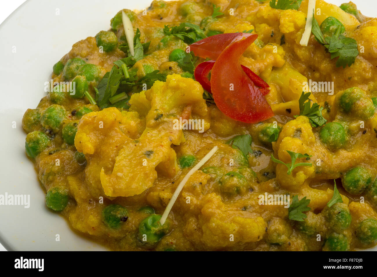 Gobi Mutter Kaju - cauliflower with green peas and cashew Stock Photo ...