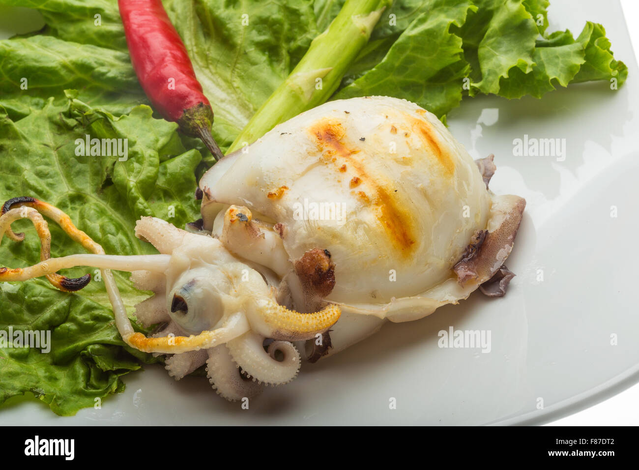 Grilled cuttlefish with salad and pepper Stock Photo - Alamy