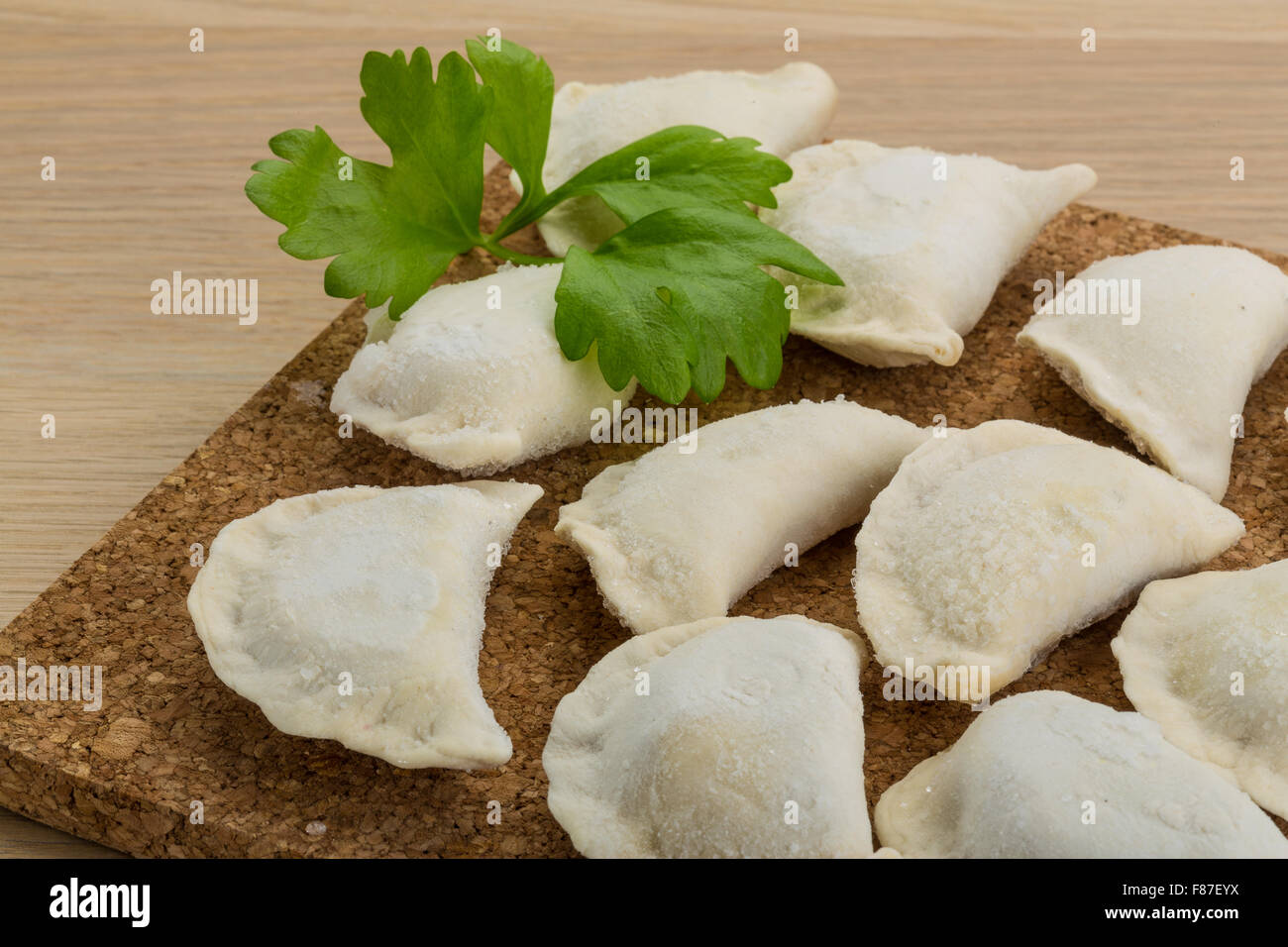 Raw Ukrainian vareniki on the board Stock Photo - Alamy