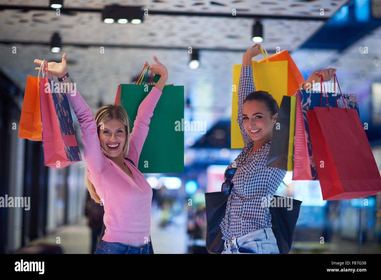 happy young girls in shopping mall, friends having fun together Stock ...