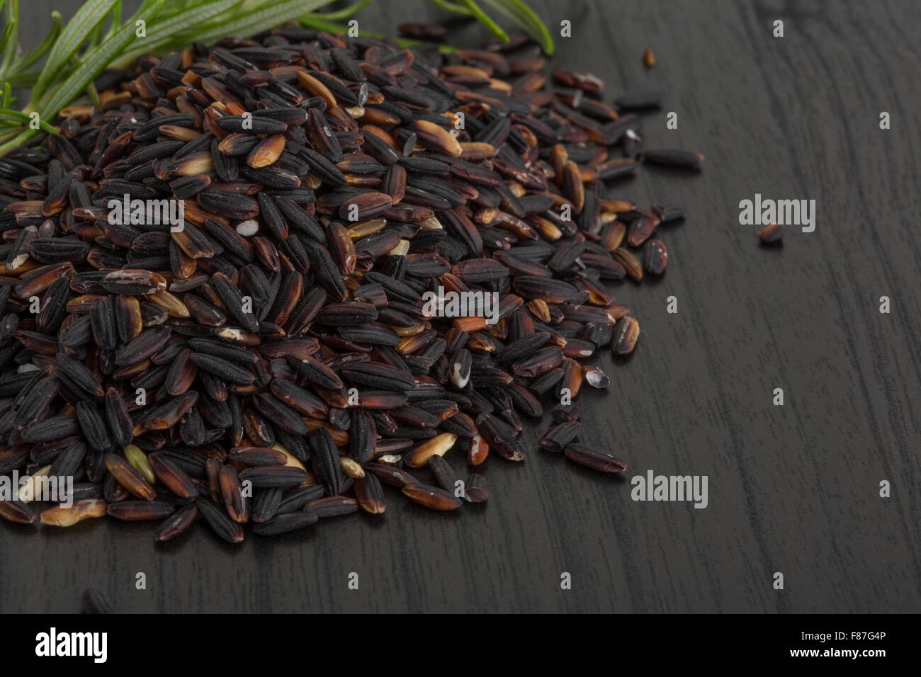Raw wild rice with herbs Stock Photo - Alamy