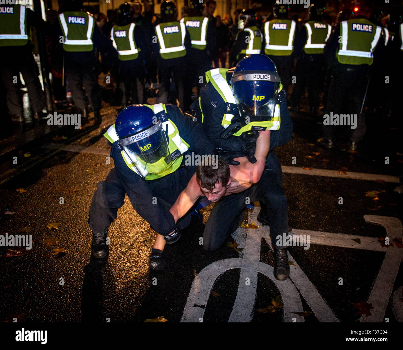 Riot police arrest protesters during the disorder near Trafalgar Square ...