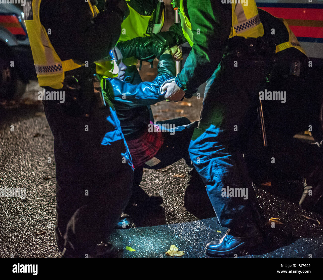 Riot police arrest protesters during the disorder near Trafalgar Square ...