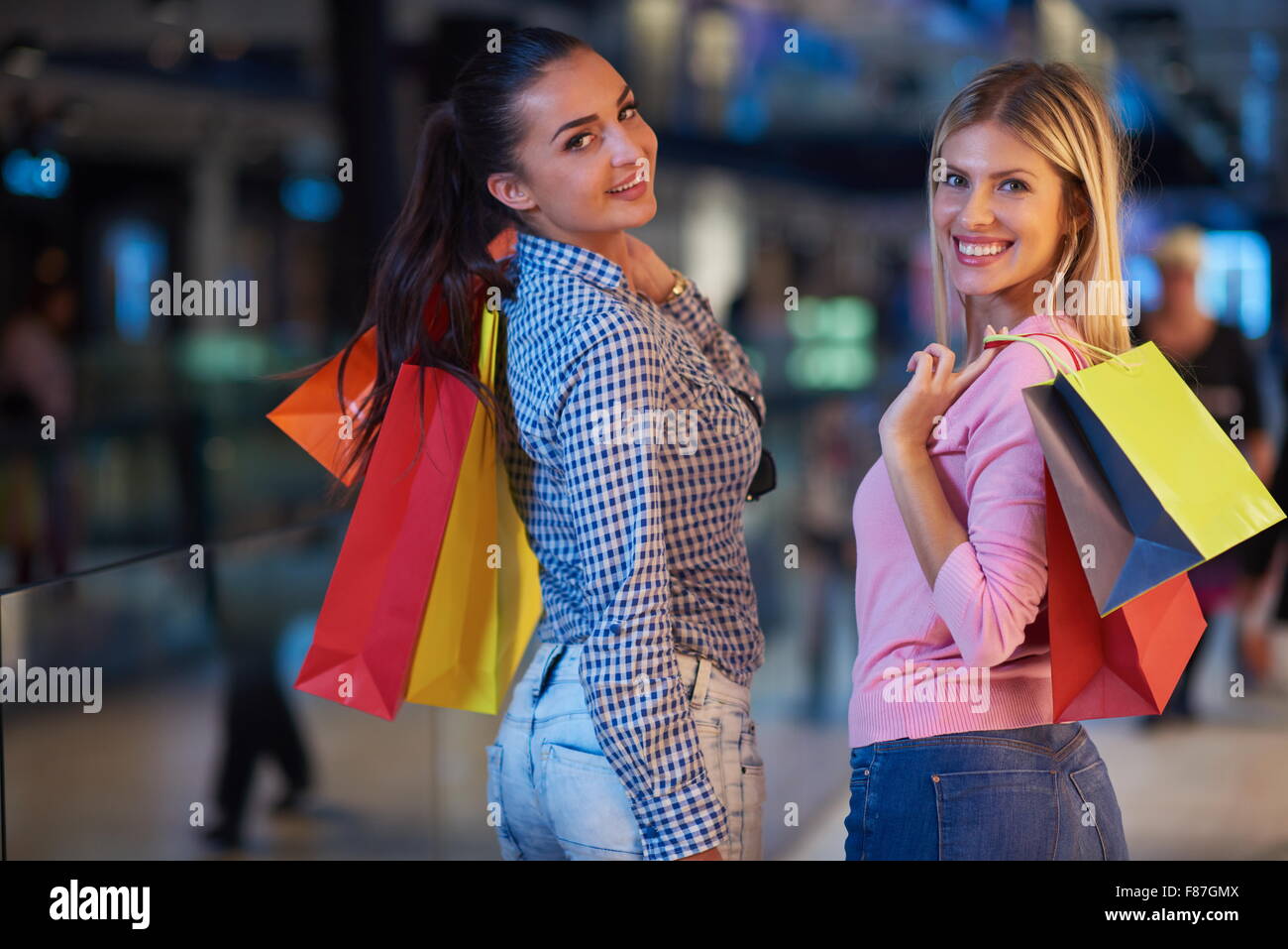 happy young girls in shopping mall, friends having fun together Stock ...