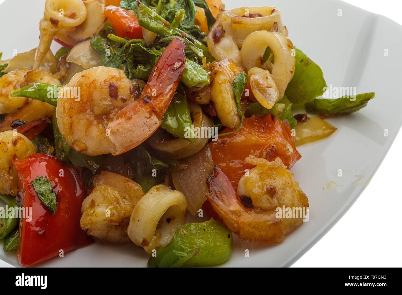 Seafood with vegetables - shrimps and calamari Stock Photo - Alamy