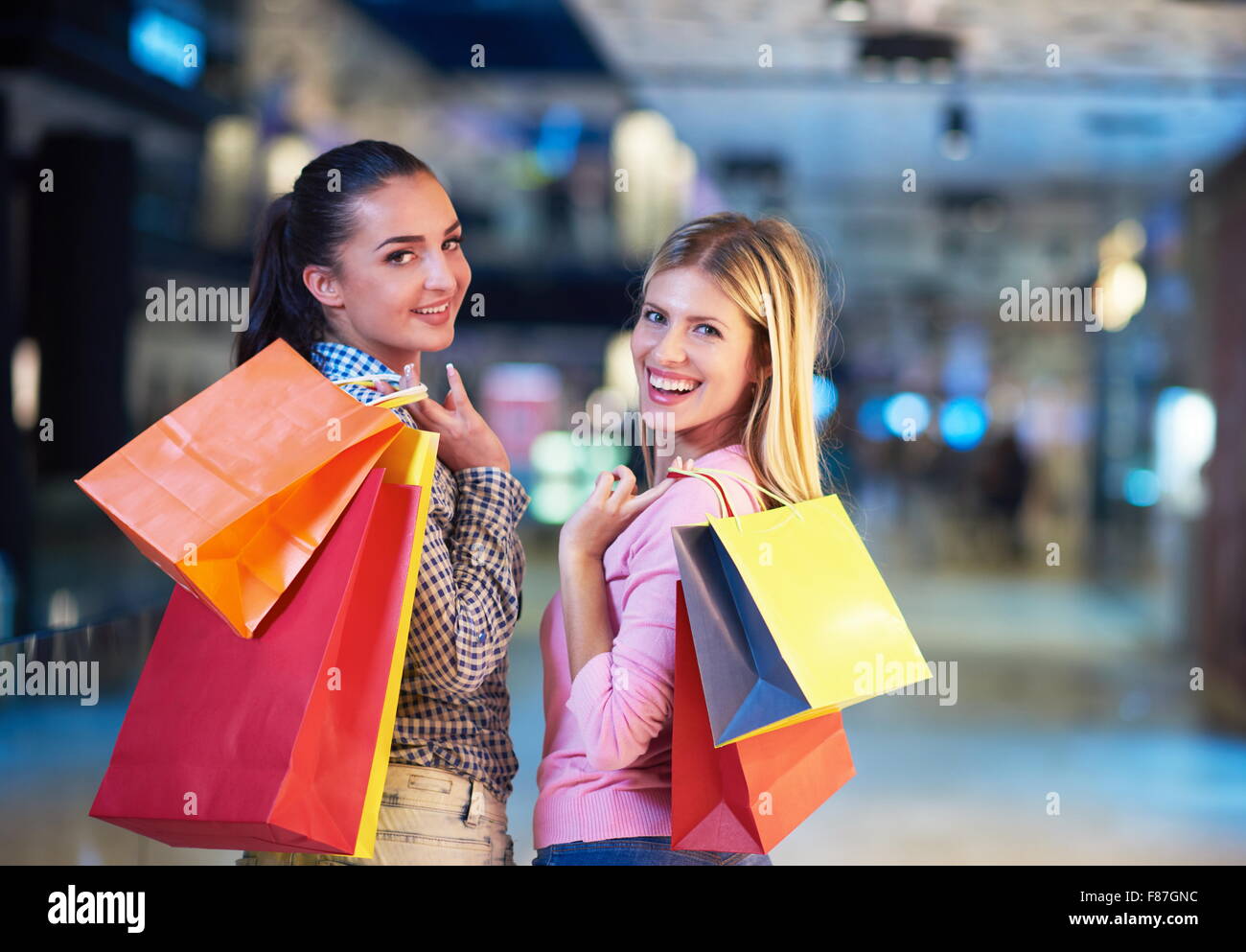 happy young girls in shopping mall, friends having fun together Stock ...