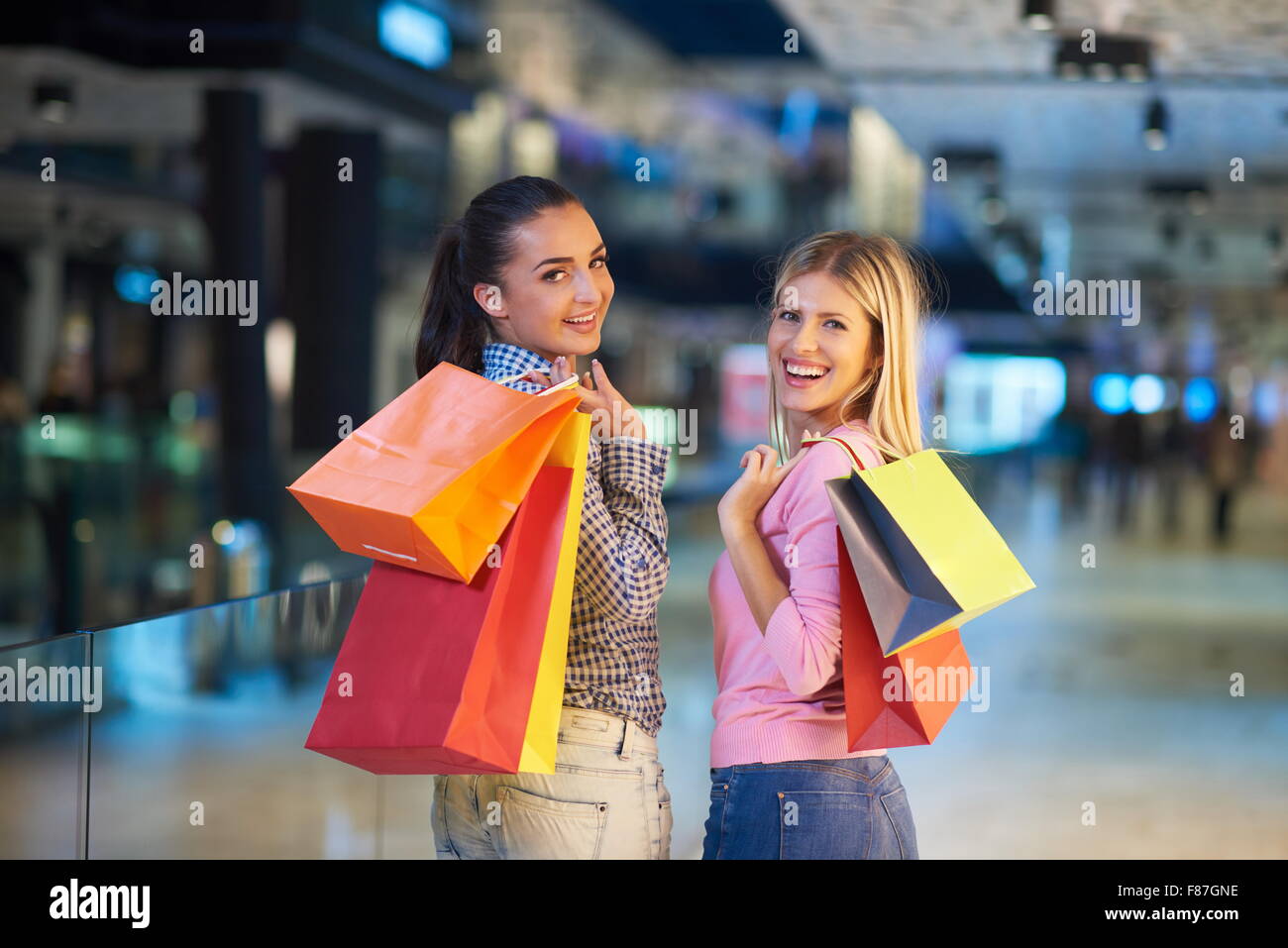 happy young girls in shopping mall, friends having fun together Stock ...