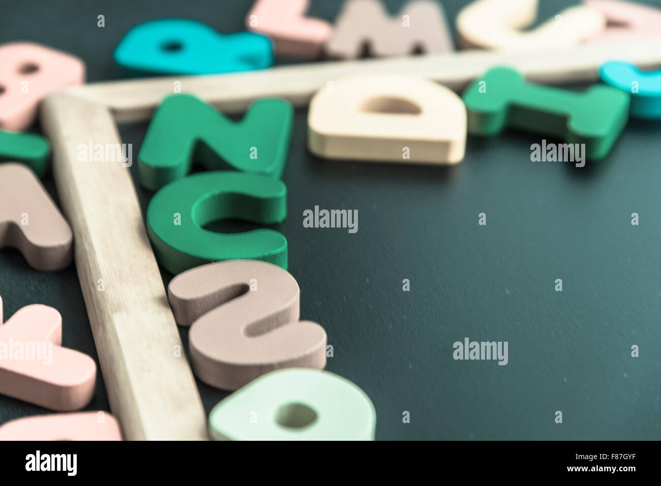 Corner of black board with colorful alphabet Stock Photo - Alamy