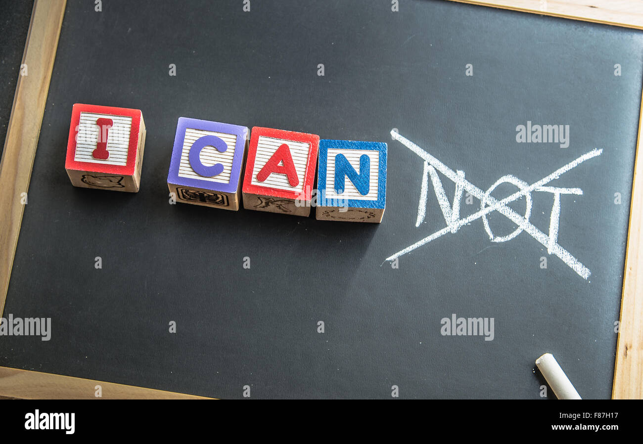 Wooden word I can not on black board Stock Photo - Alamy