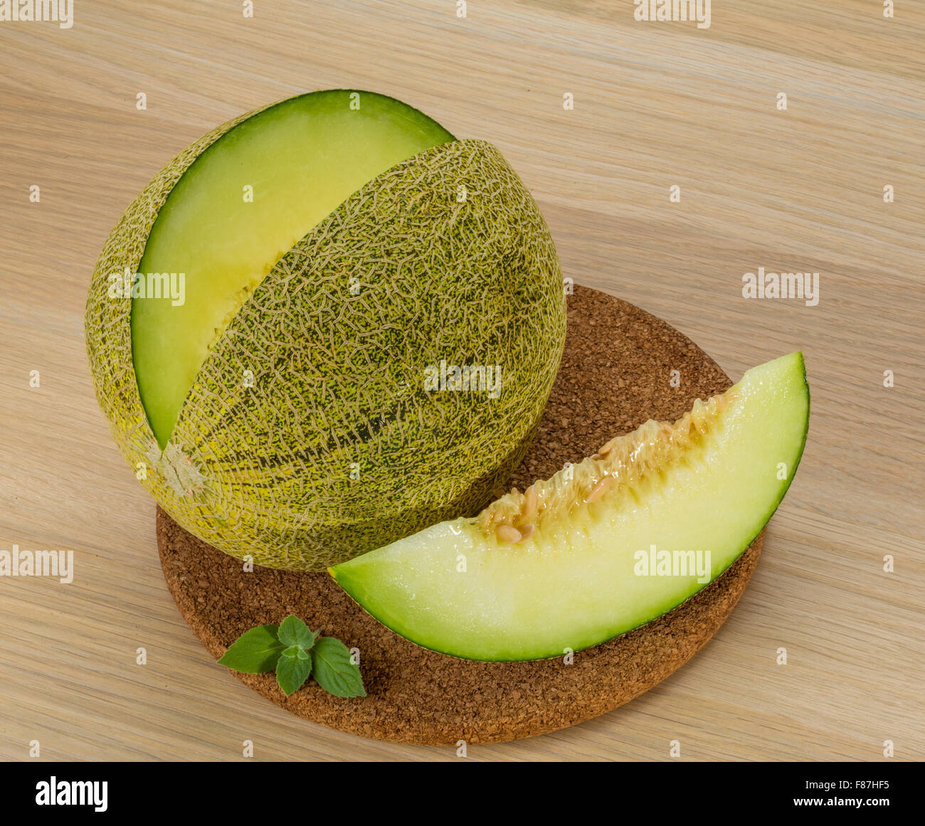Fresh ripe melon sliced on the desk Stock Photo - Alamy